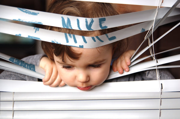 Child Glancing Through a Venetian Blind / 100324 – XMPie MARKETPLACE